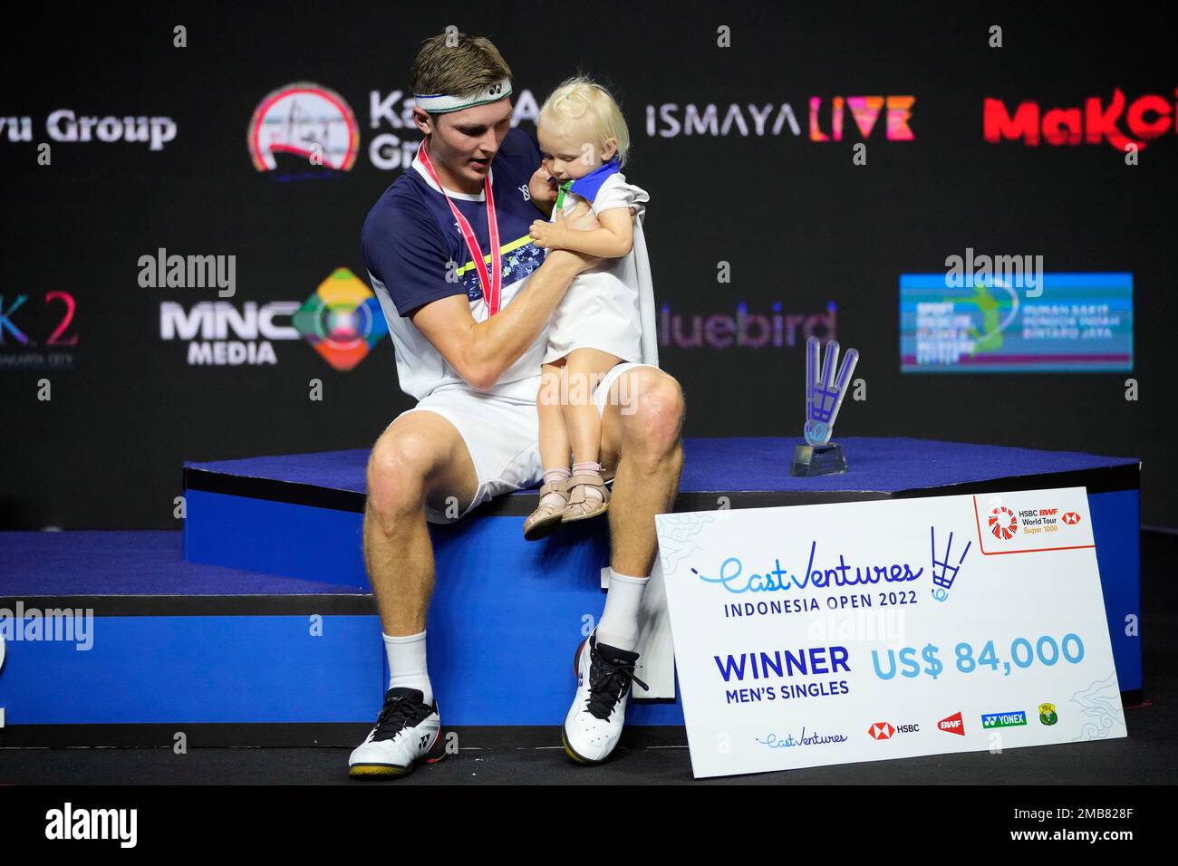 Denmark's Viktor Axelsen celebrates on the podium with his daughter ...