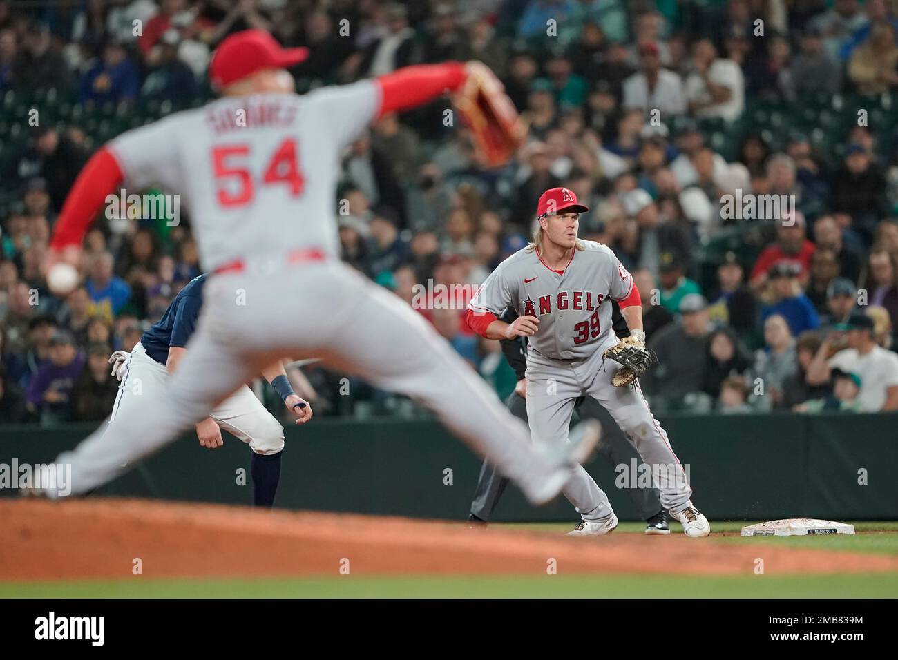 Los Angeles Angels first baseman David MacKinnon, right, watches the ...
