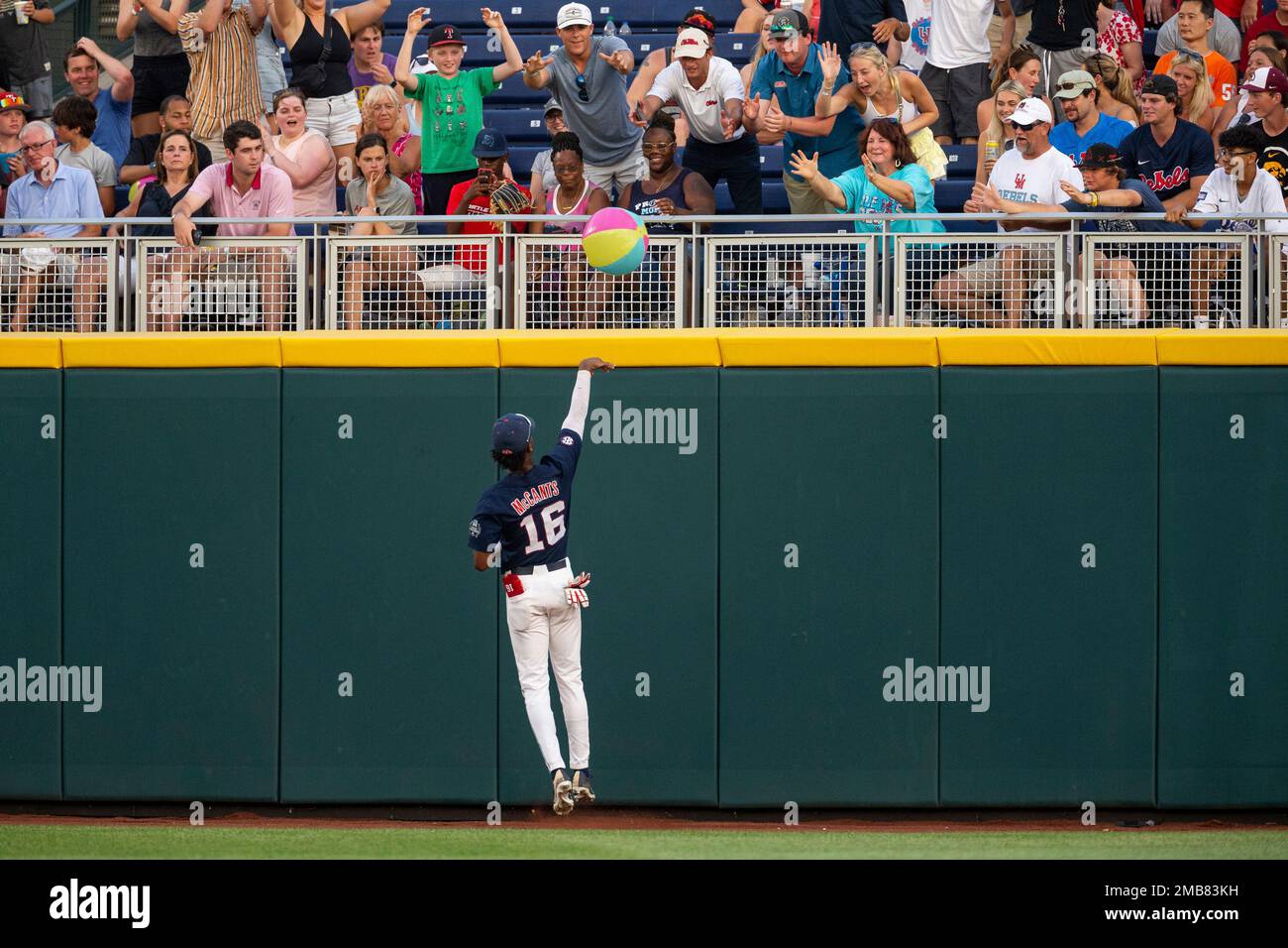 Mississippi center fielder TJ McCants (16) throws a beach ball to the ...