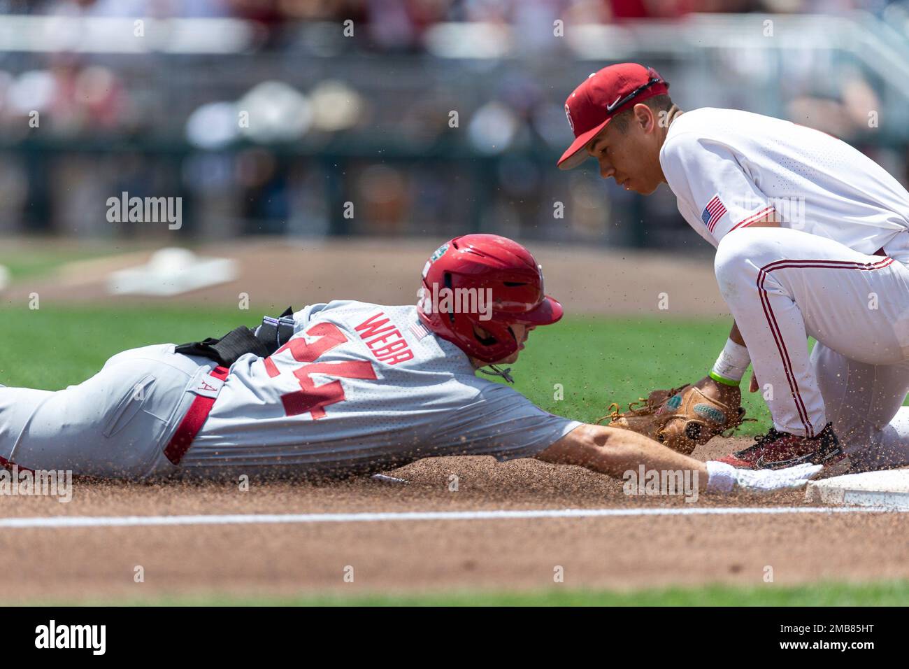 Arkansas Braydon Webb (24) slides to third base for a triple in the ...