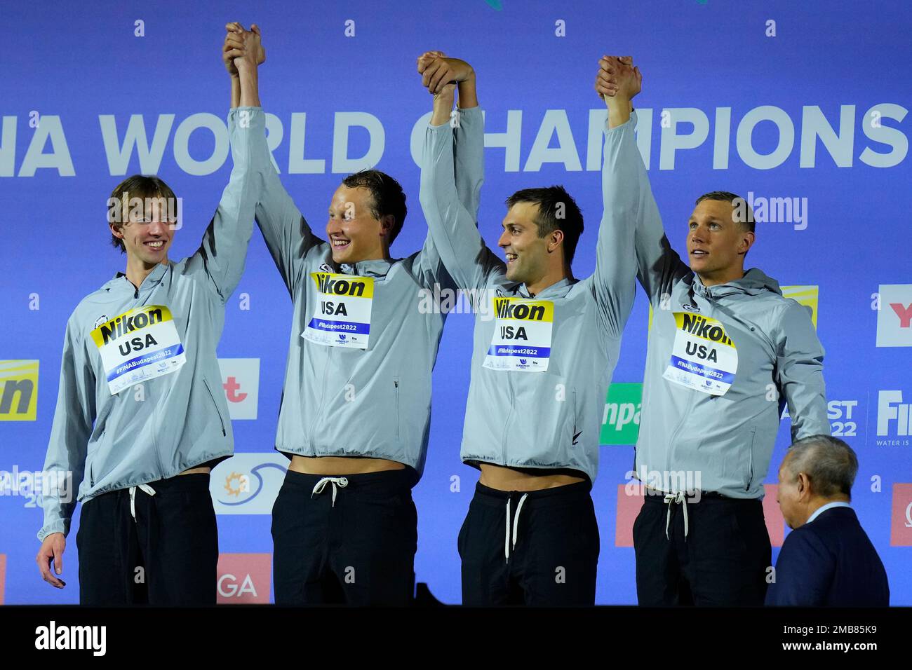 Members of team United States celebrate on the podium after winning the ...