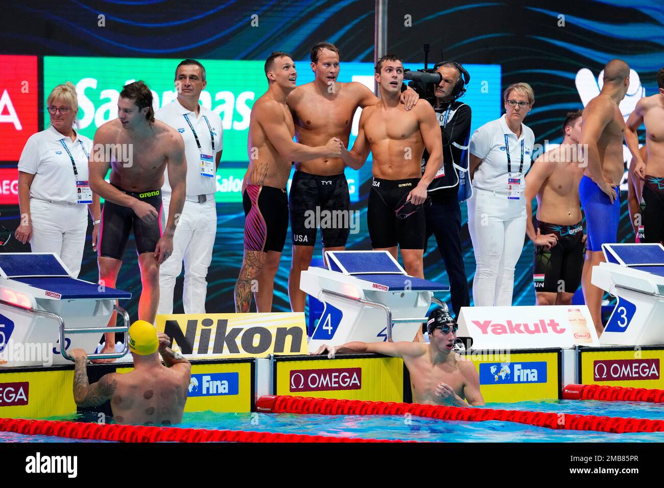 Members of team United States celebrate after winning the men's 4x100m ...