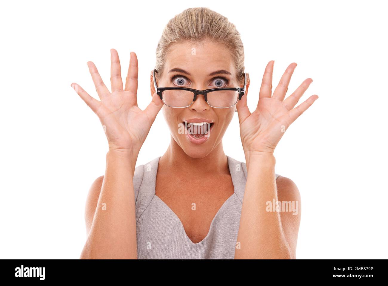 Shock, surprise and portrait of a woman with glasses in a studio with a omg, wow or wtf facial ...