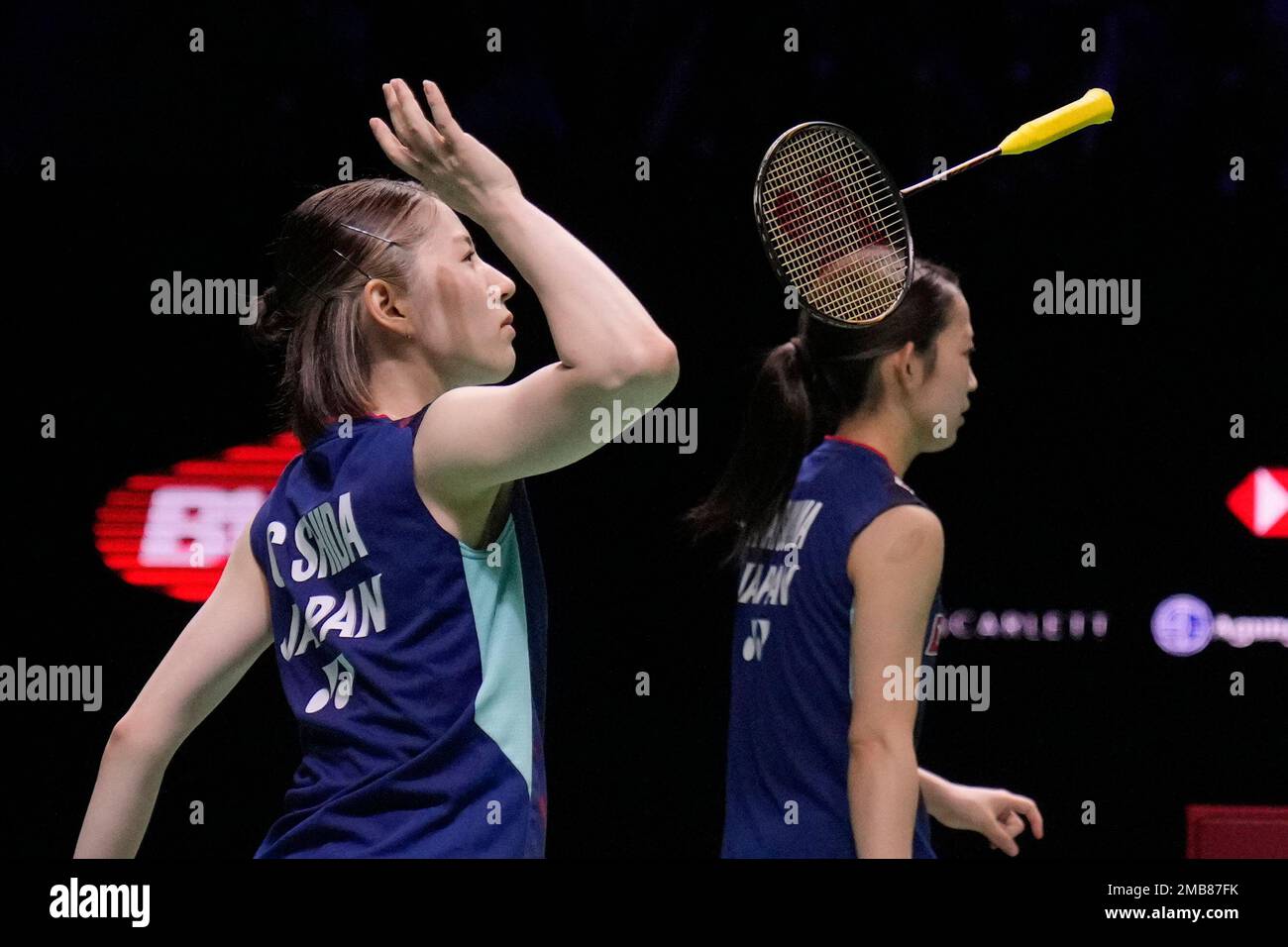 Japan's Chiharu Shida throws her racket after losing a point as she and ...