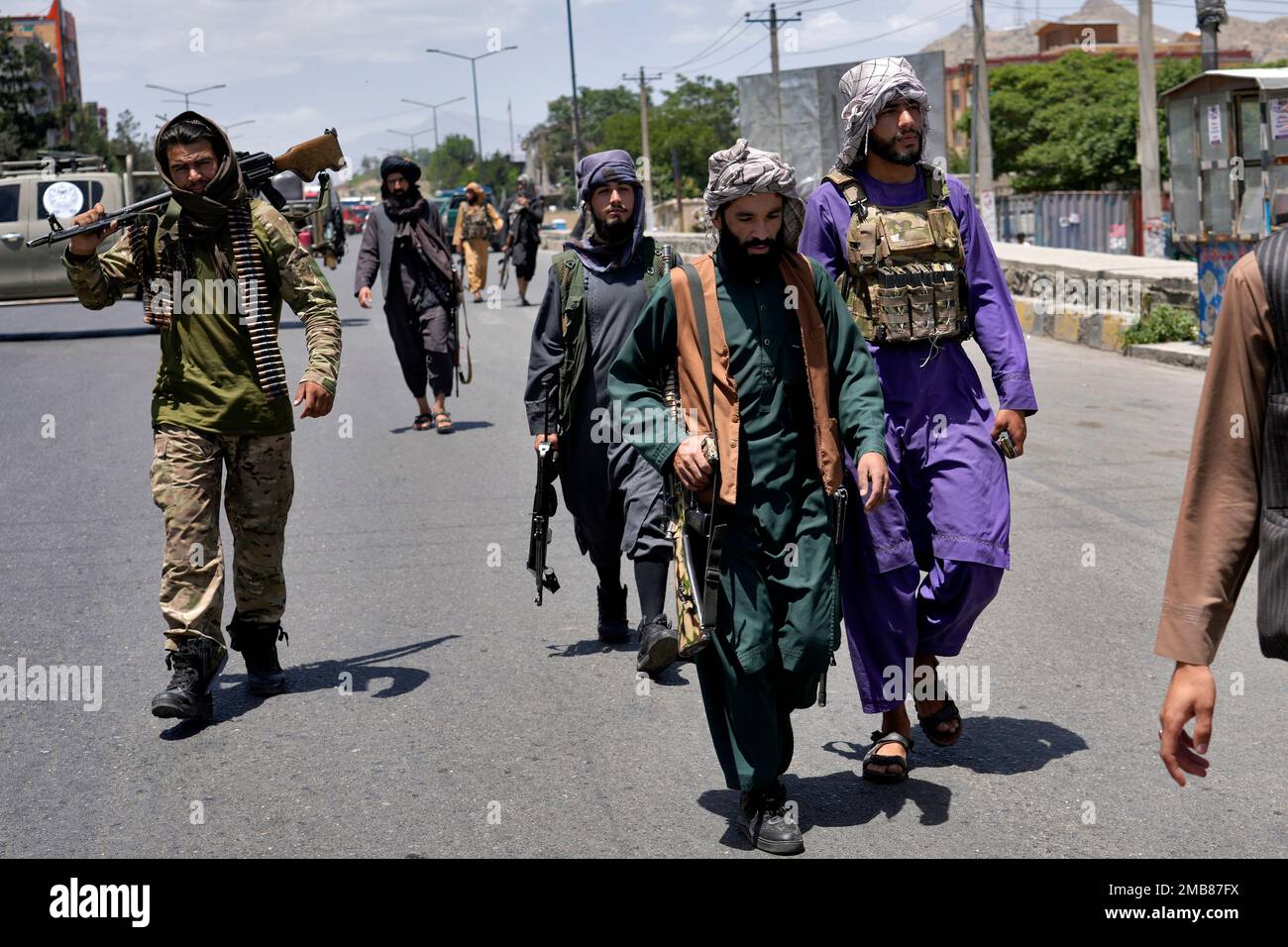 Taliban fighters guard at the site of an explosion in Kabul ...