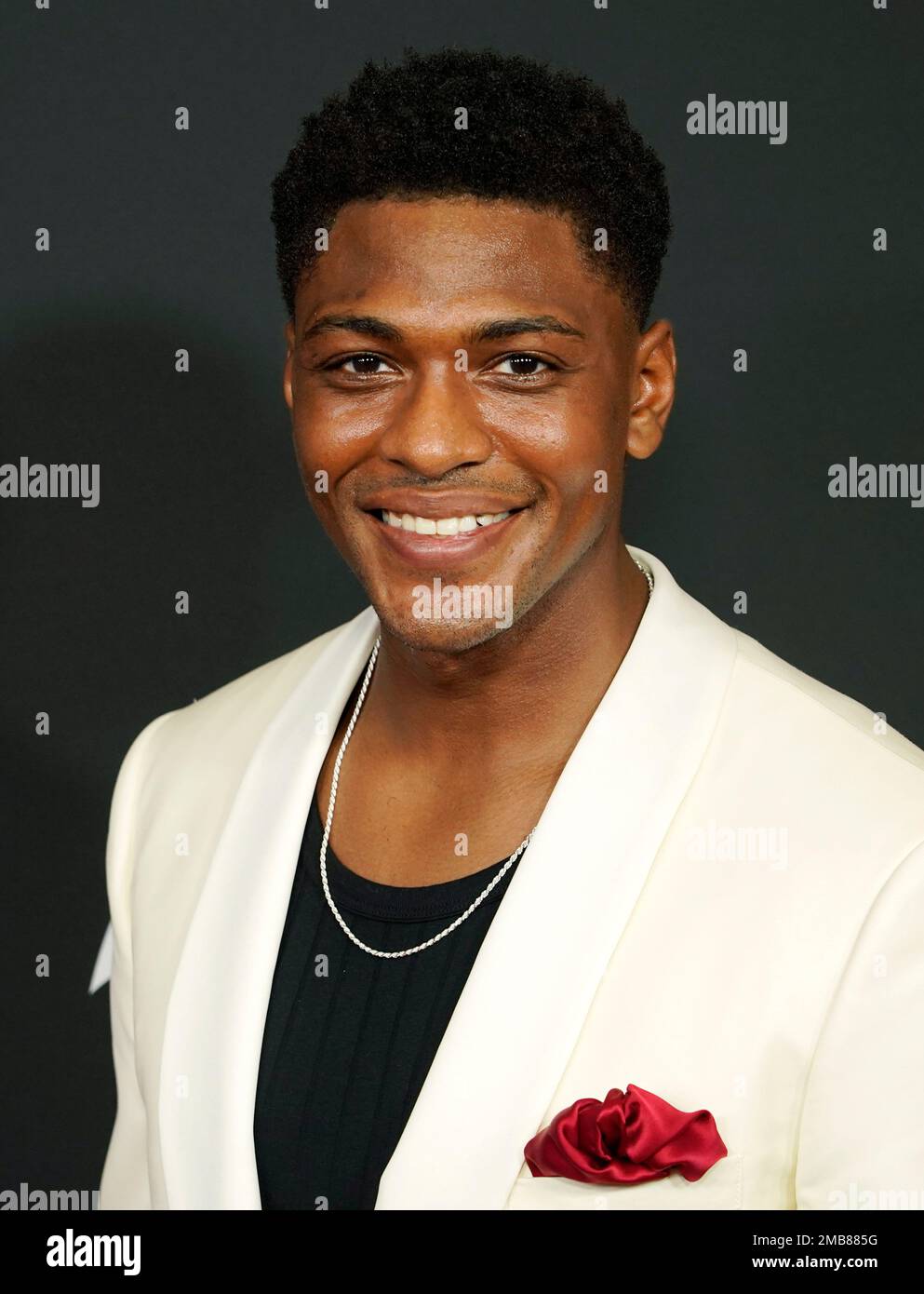 Justin Cornwell poses at the season three premiere of the Netflix show ...