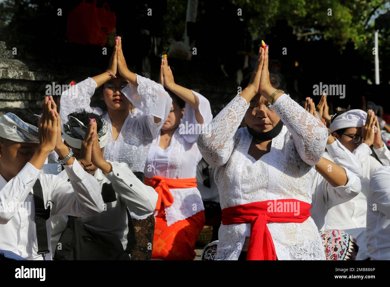Balinese Hindus pray as they celebrate the Kuningan festival at Sakenan ...