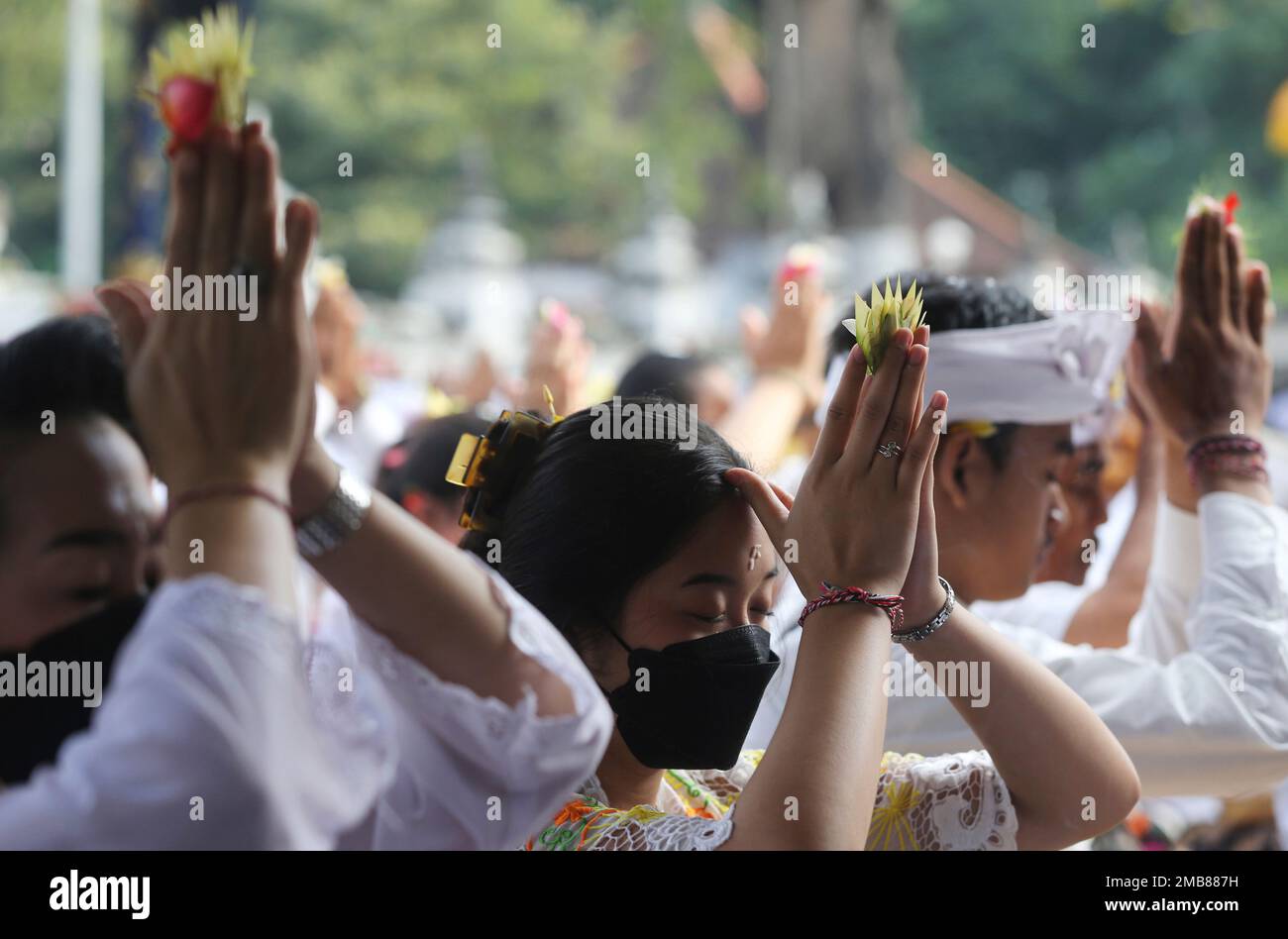 Balinese Hindus pray as they celebrate the Kuningan festival at Sakenan ...