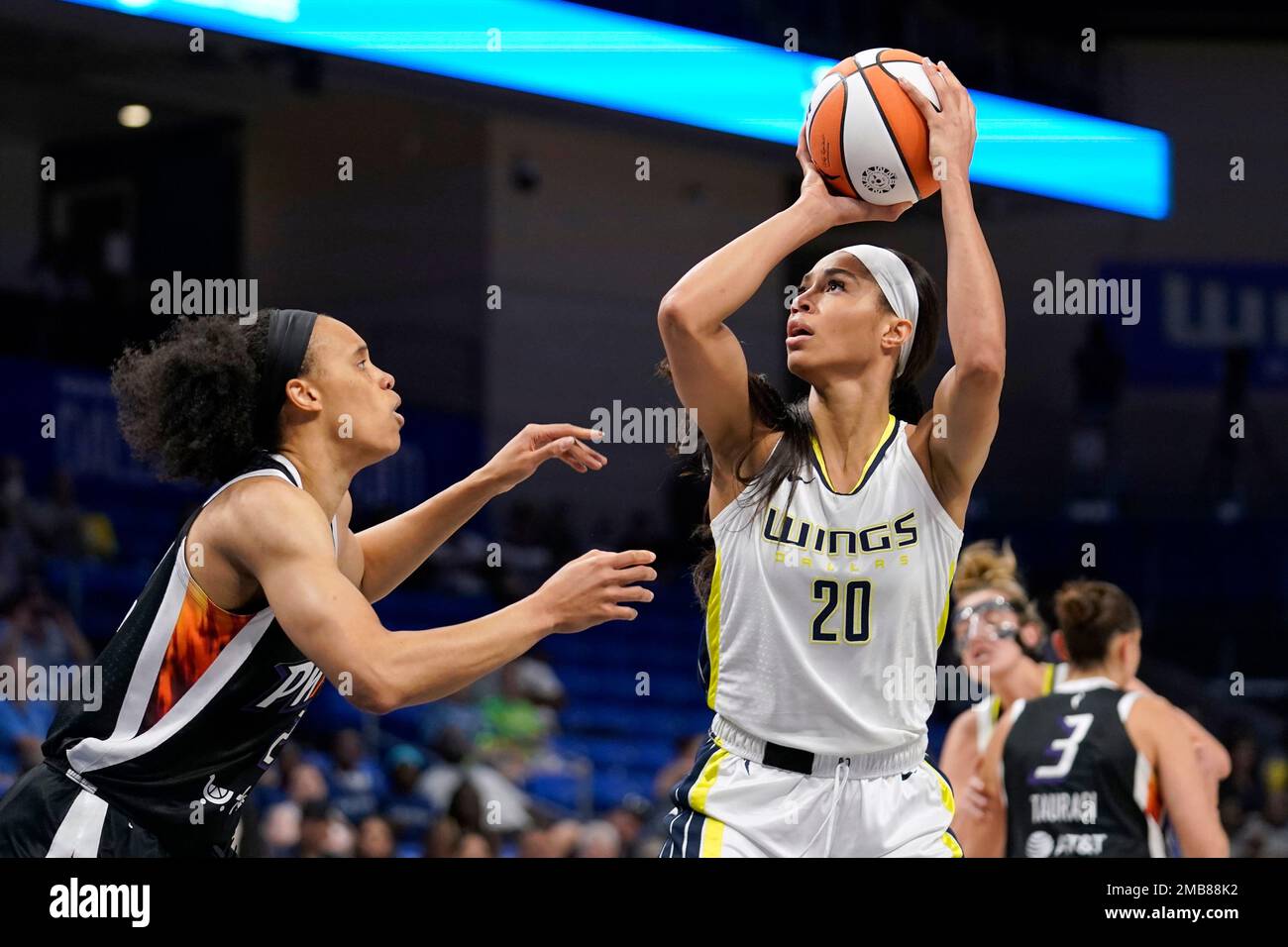 Phoenix Mercury forward Brianna Turner, left, defends as Dallas Wings ...