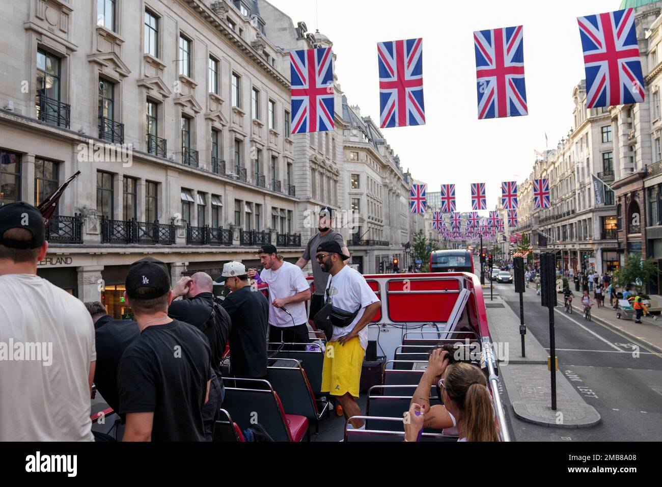 An open top bus travels through London, with KSI and Logan Paul ...