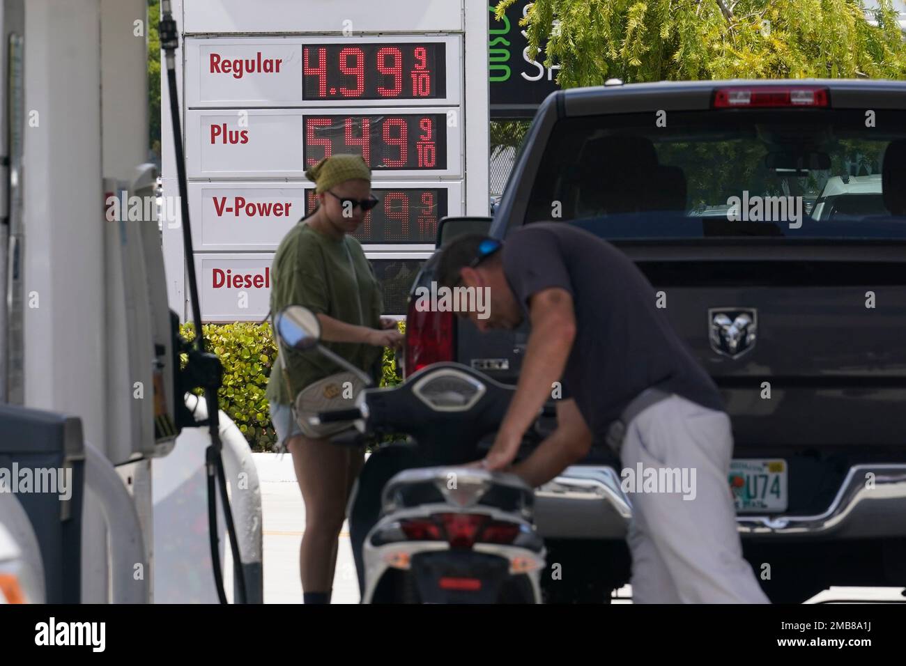 Customers fill up at a Shell gas station, Friday, June 17, 2022, in ...