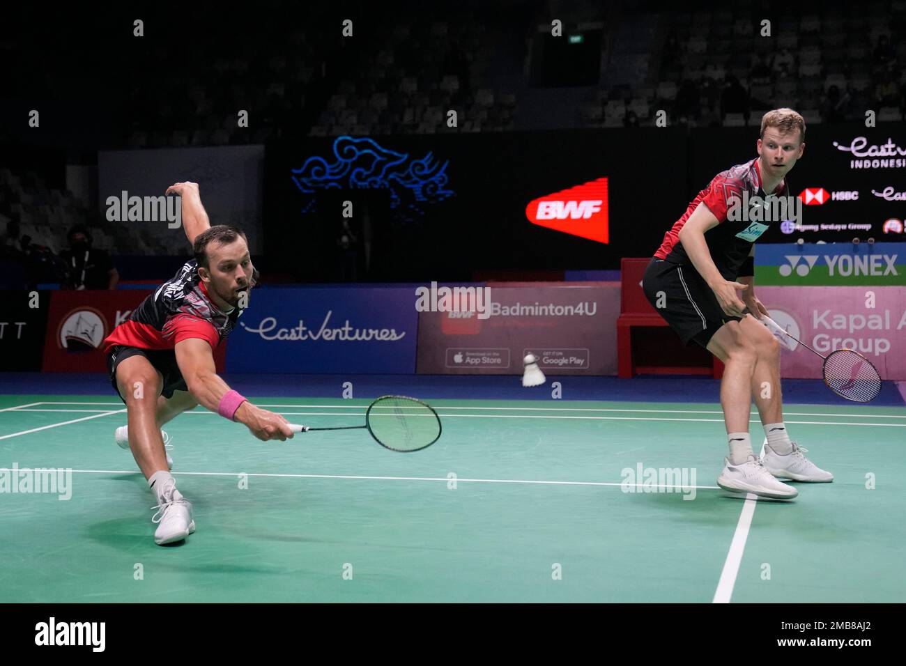Denmark's Kim Astrup, right, and Anders Skaarup Rasmussen compete ...