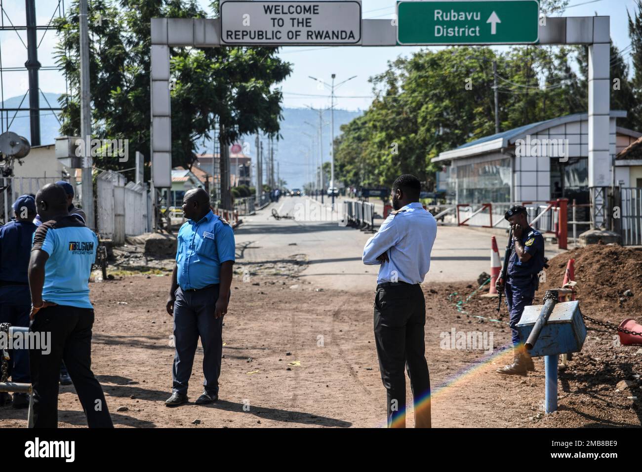 Congolese border police and others stand on their side of the Petite ...