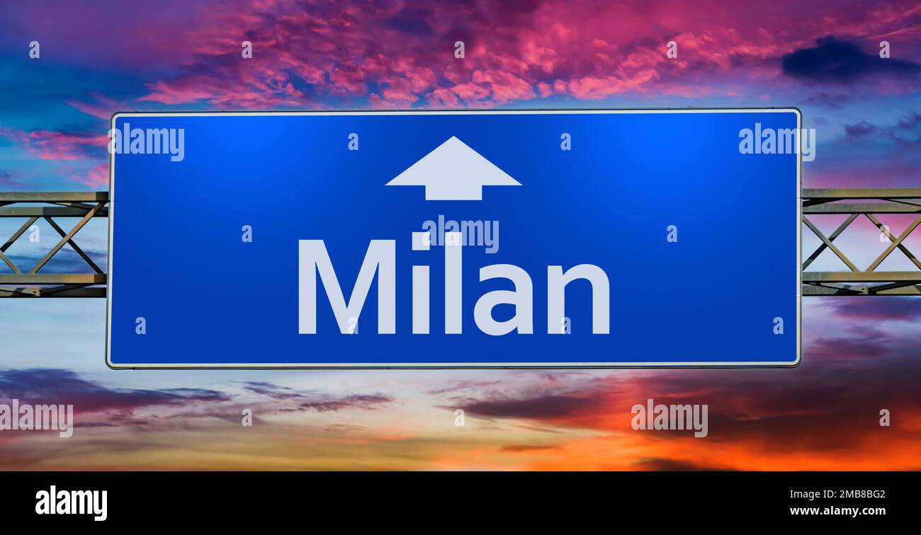 Road sign indicating direction to the city of Milan Stock Photo - Alamy