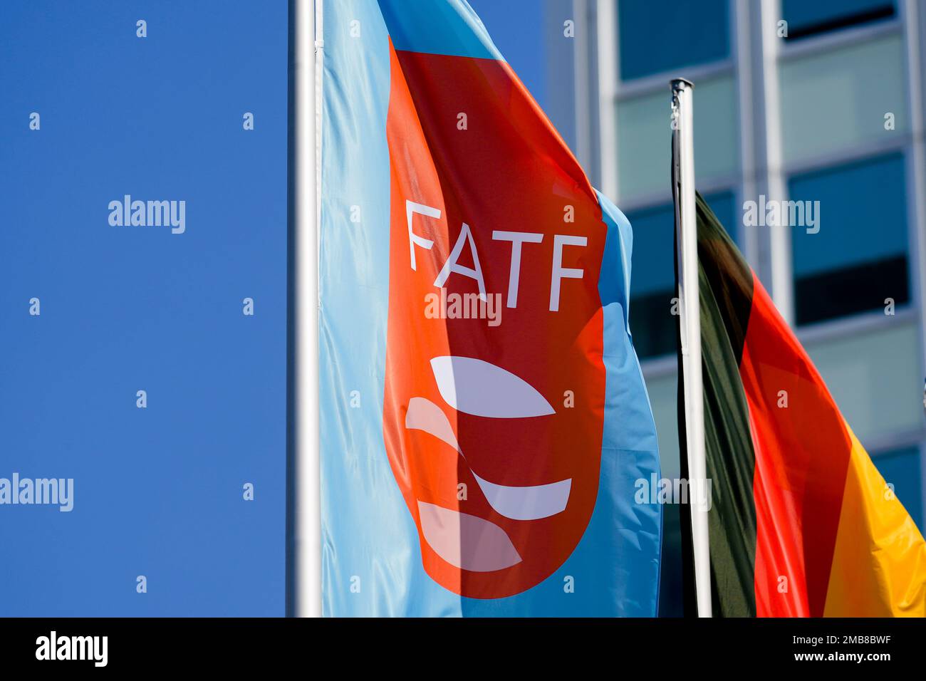 A falg with the logo of the Financial Action Task Force, FATF, waves in ...