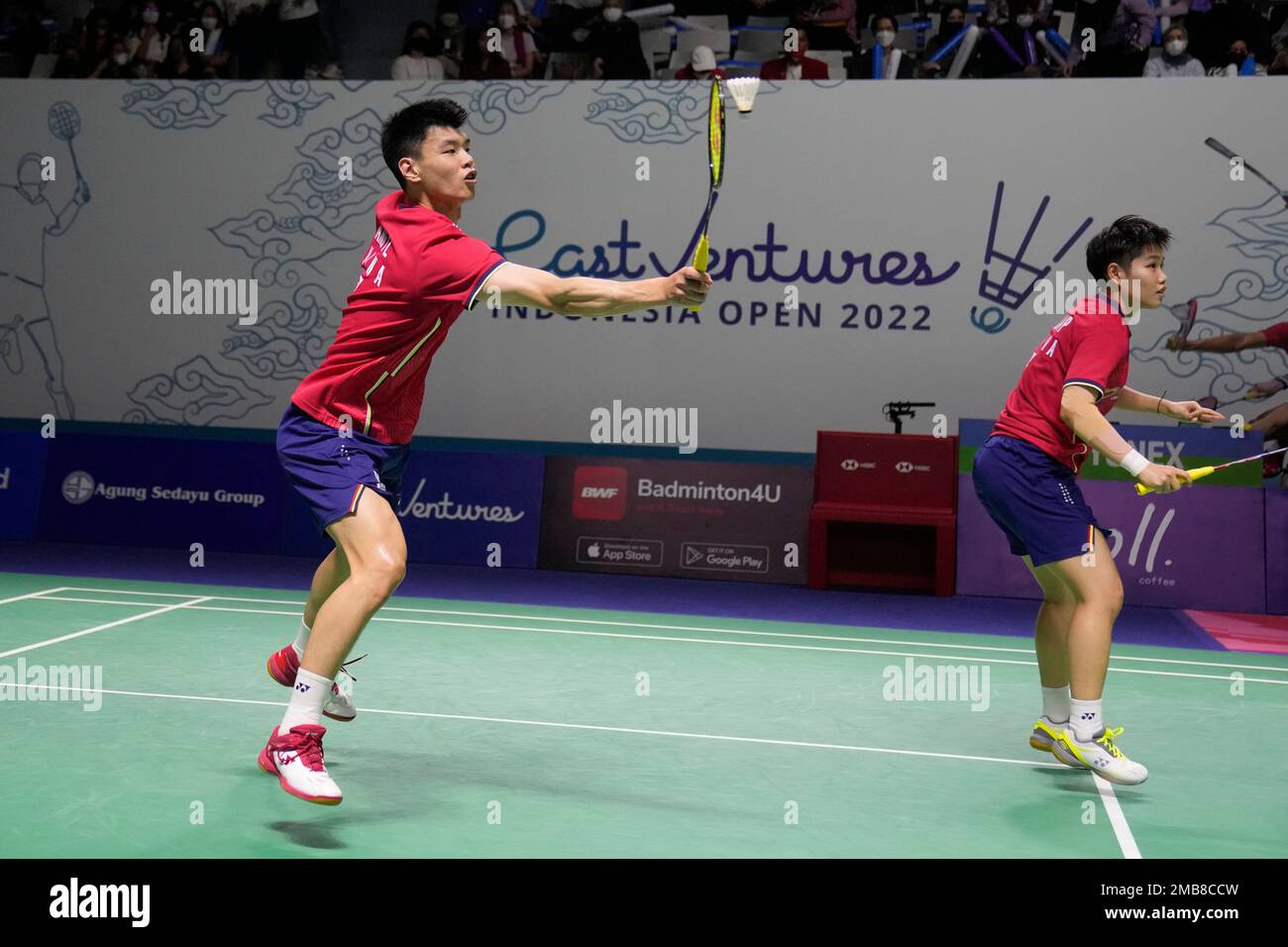 China's Wang Yi Lyu, left, and Huang Dong Ping compete against Malaysia ...