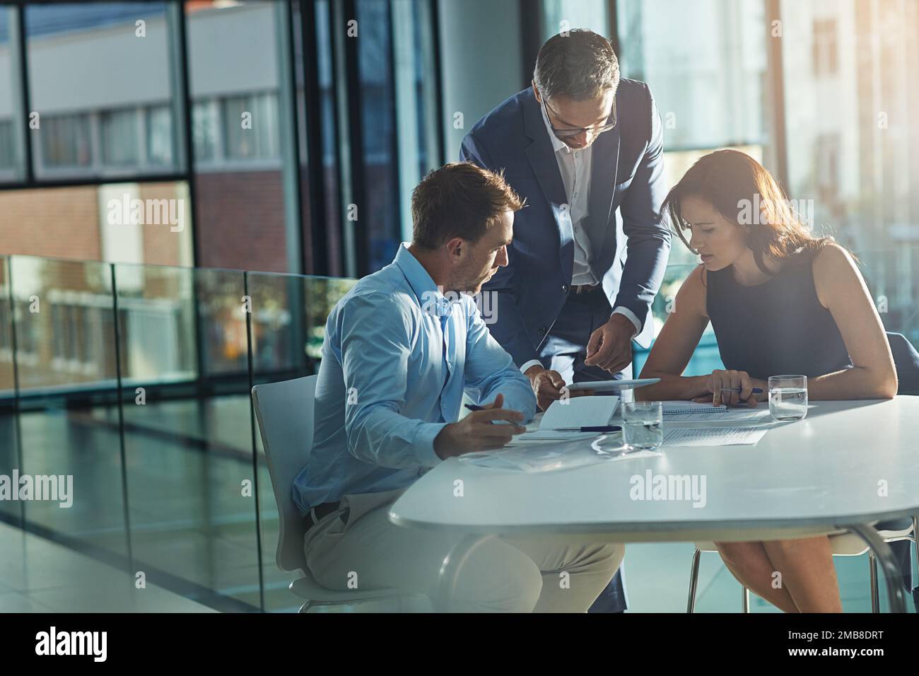 Men, woman and tablet at business meeting in office planning, goals or ...
