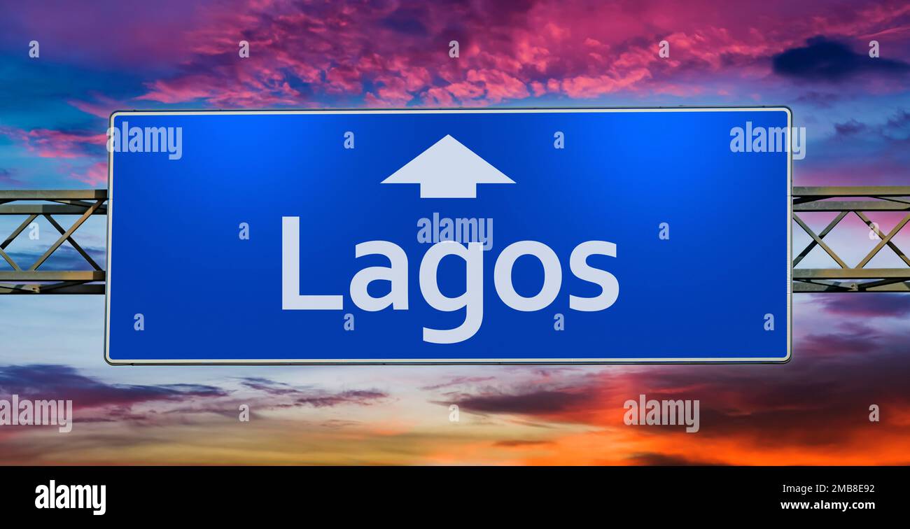 Road sign indicating direction to the city of Lagos Stock Photo - Alamy