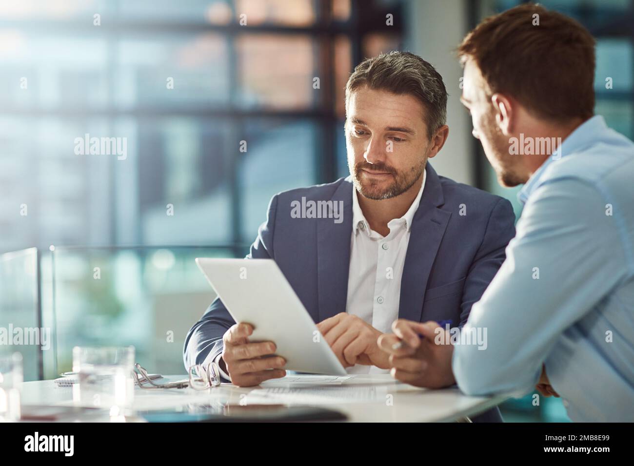 Teamwork meeting, tablet and business people in office workplace ...