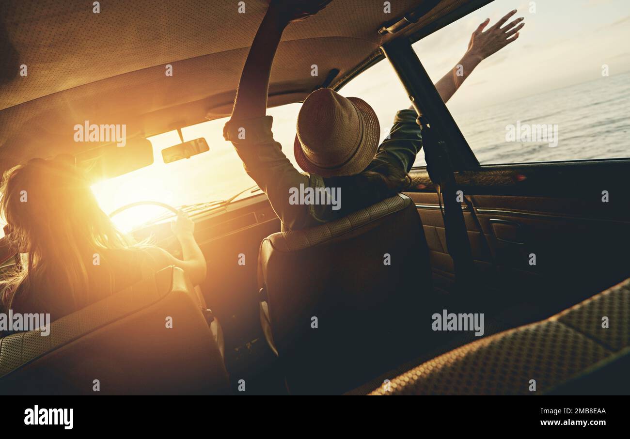 Friends, women and sunset road trip at beach with car, hands and window ...
