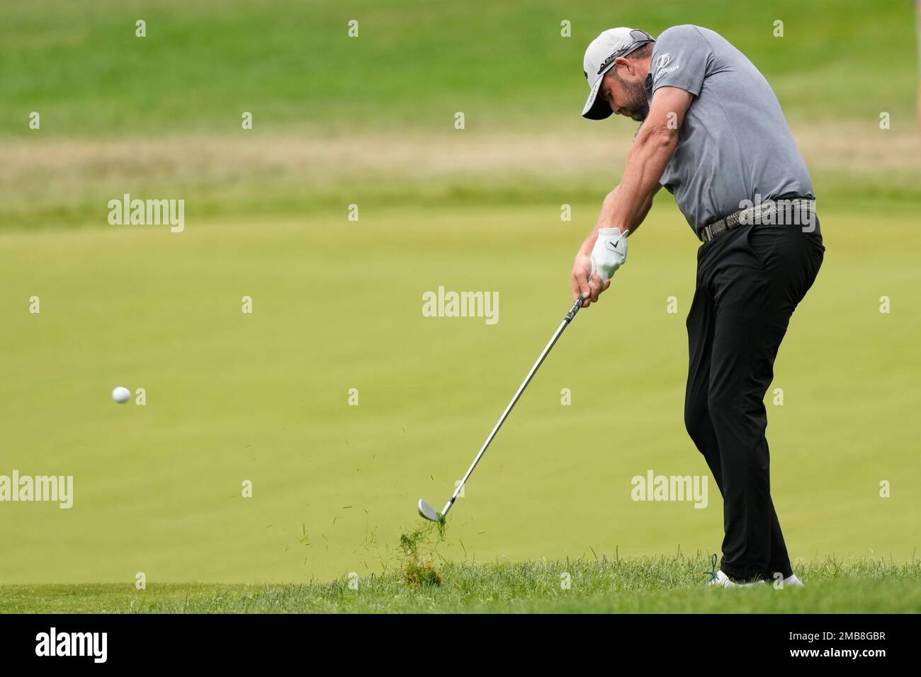 Marc Leishman, of Australia, hits on the ninth hole during the first ...