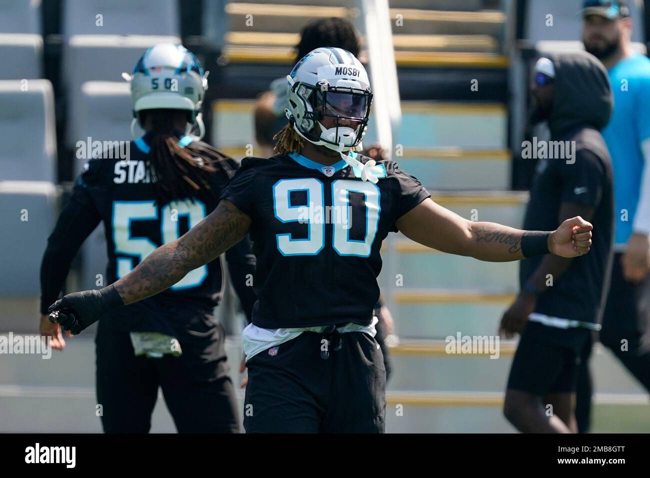 Carolina Panthers' Arron Mosby warms up during an NFL football minicamp ...