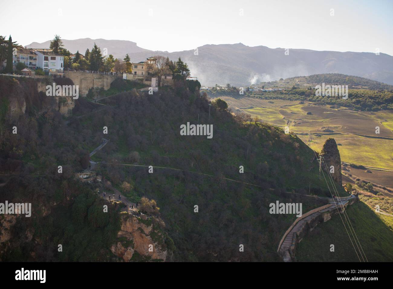 Scenic view of an old stone bridge over the canyon and waterfall in ...