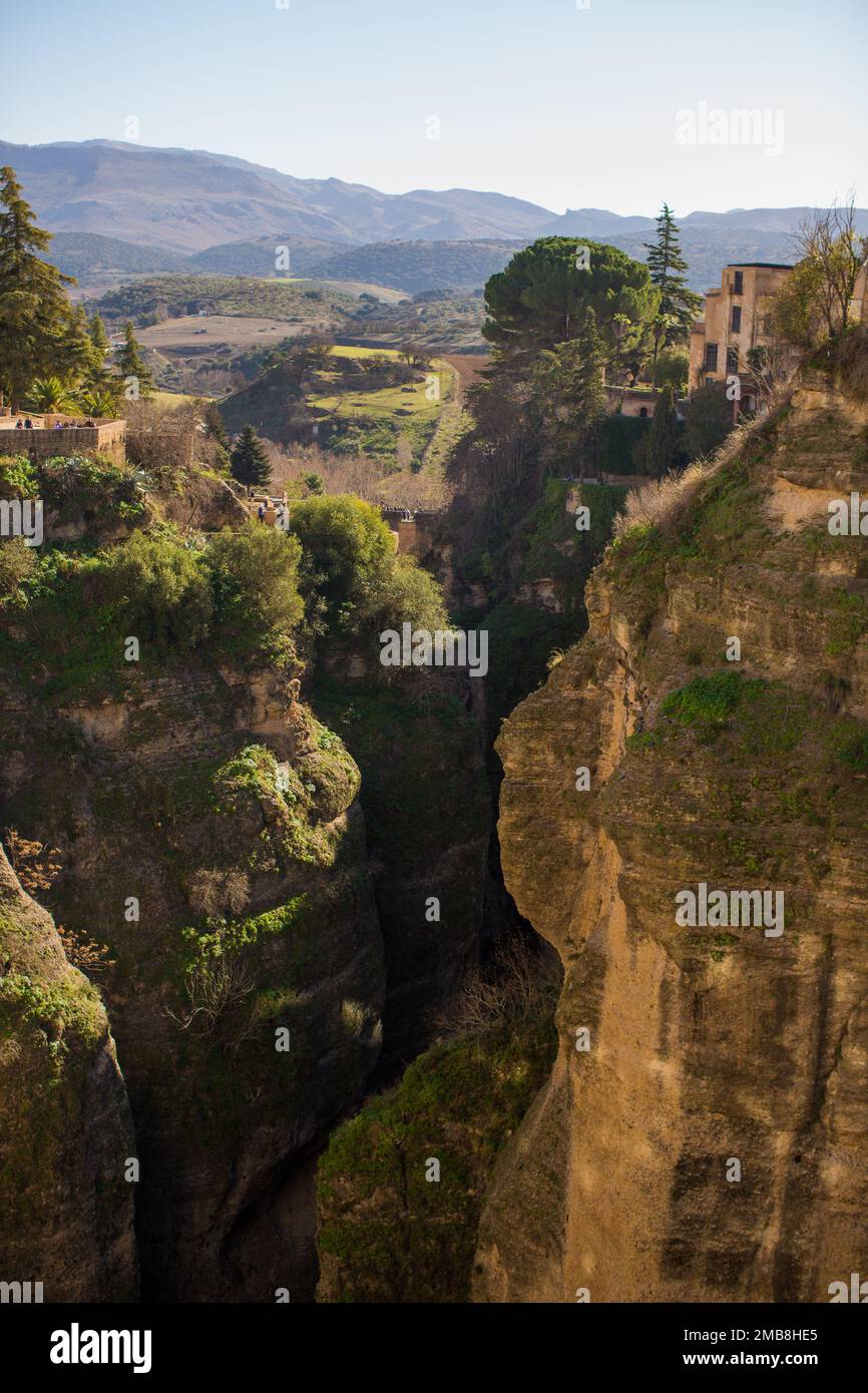 Scenic view of an old stone bridge over the canyon and waterfall in ...