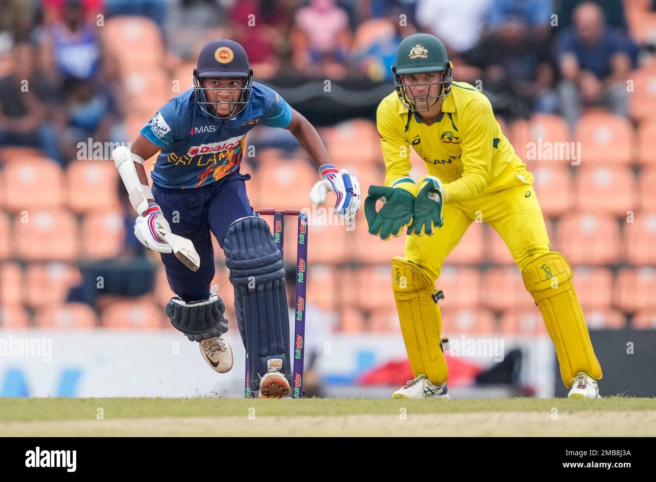 Sri Lanka's Dunith Wellalage runs between wickets as Australia's ...