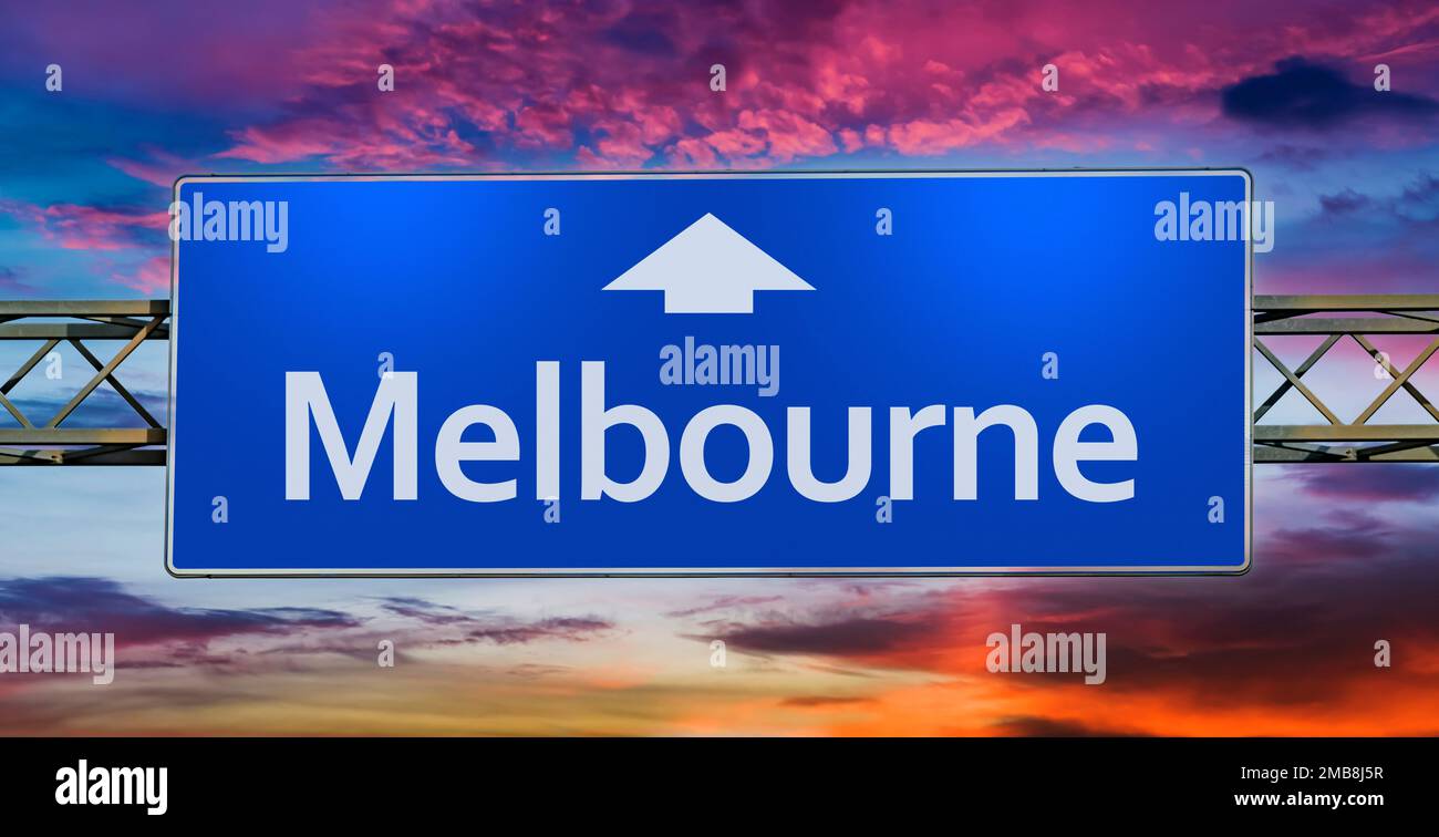 Road sign indicating direction to the city of Melbourne Stock Photo - Alamy