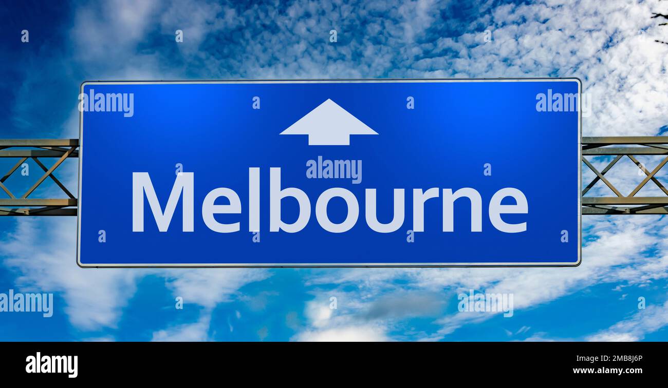 Road sign indicating direction to the city of Melbourne Stock Photo - Alamy