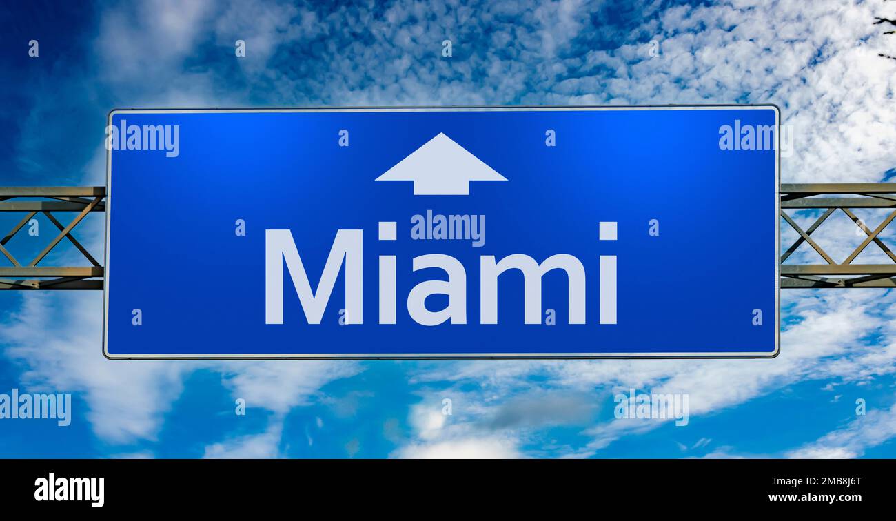Road sign indicating direction to the city of Miami Stock Photo - Alamy