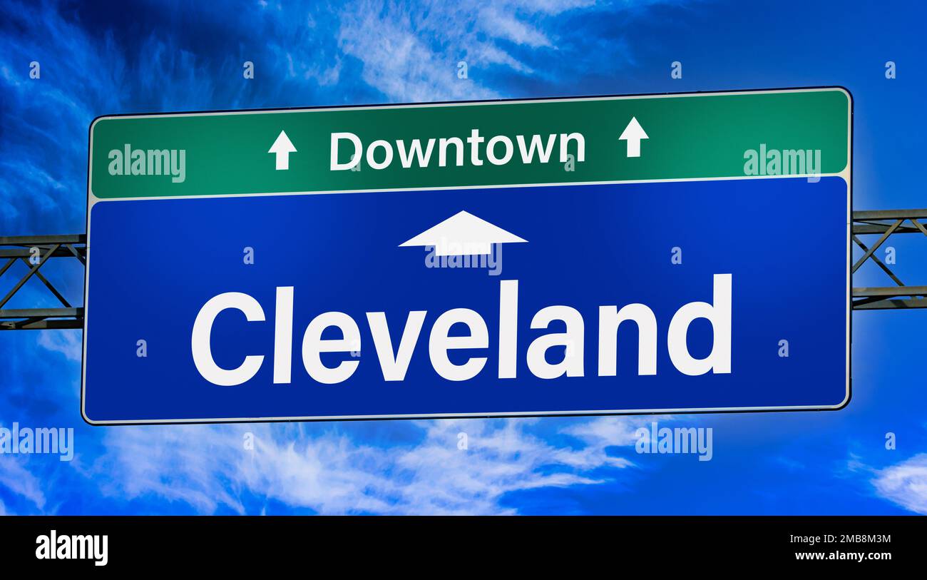 Road sign indicating direction to the city of Cleveland Stock Photo - Alamy