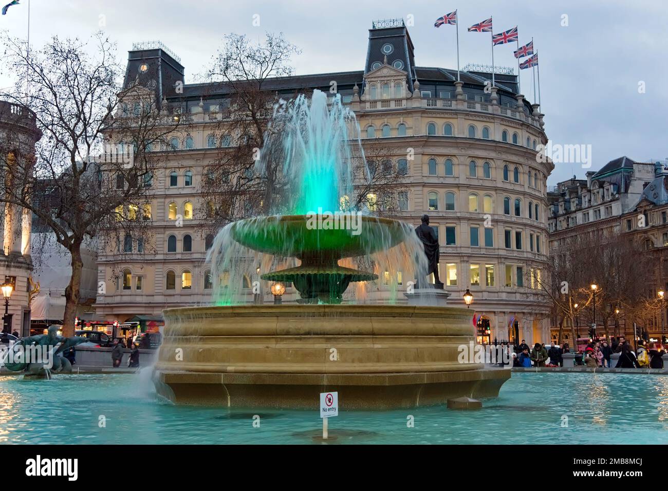One of the famous illuminated water fountains at Trafalgar Square, in ...