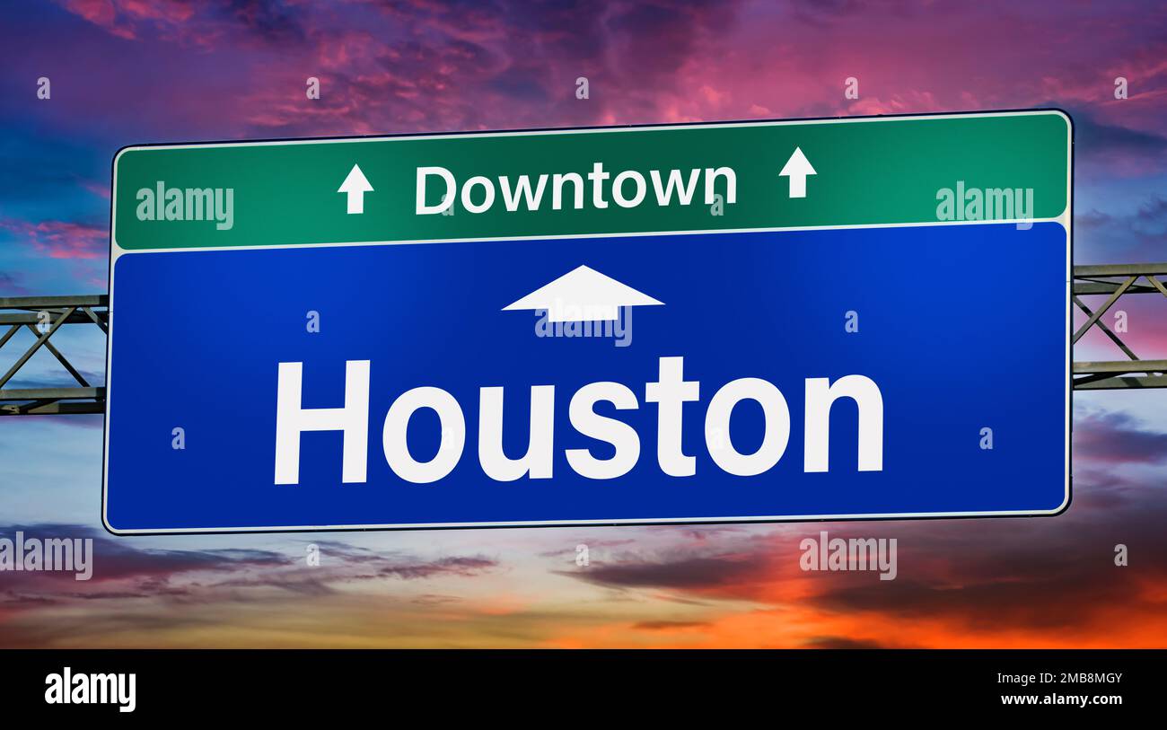 Road sign indicating direction to the city of Houston Stock Photo - Alamy