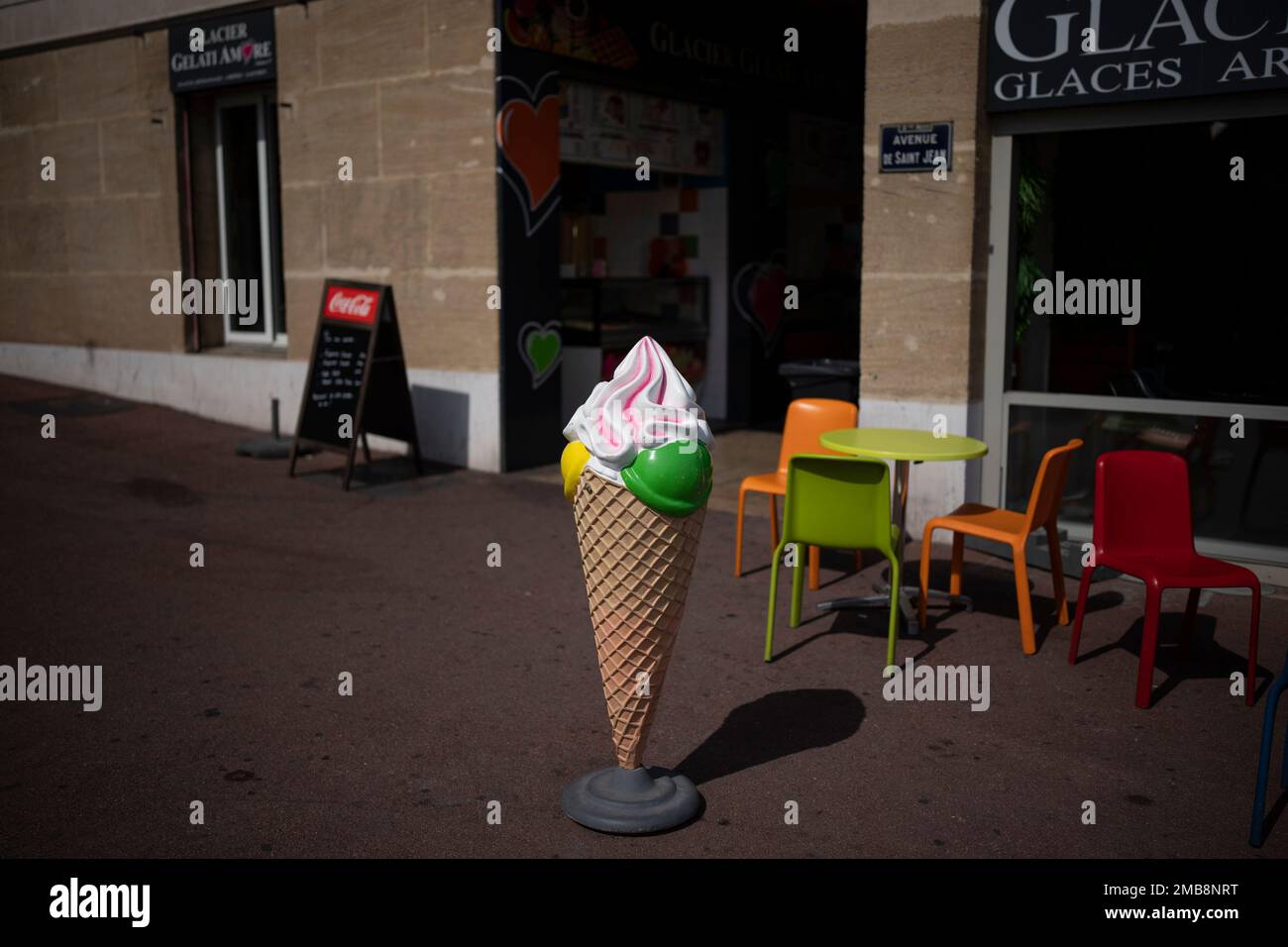 An ice cream cone sculpture sits outside an ice cream shop during a ...
