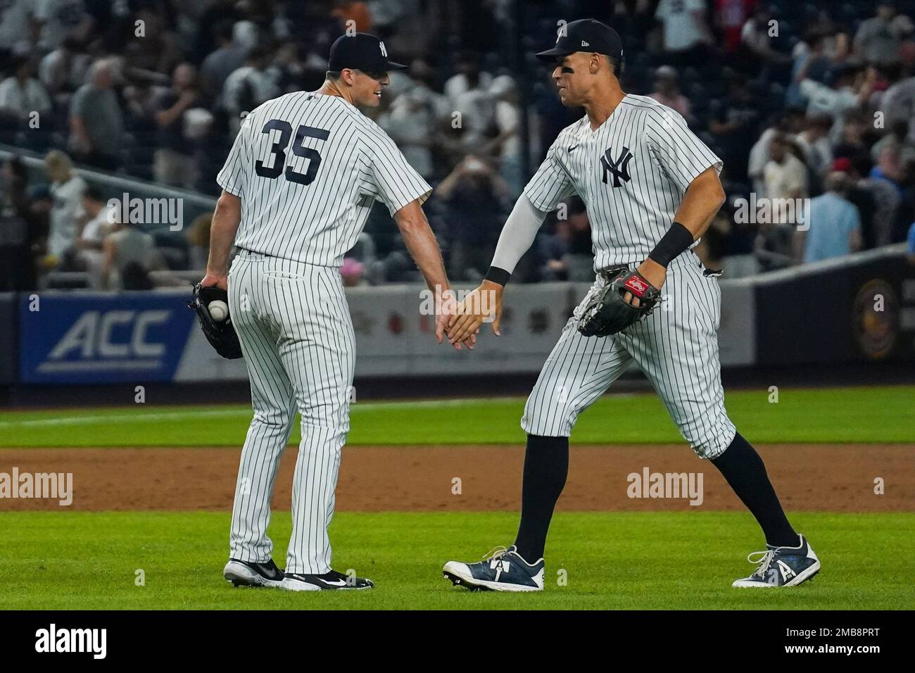 New York Yankees relief pitcher Clay Holmes (35) and New York Yankees ...