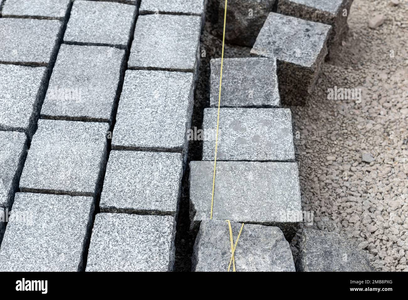 Construcion site of pavement granite cobblestone road in old city ...
