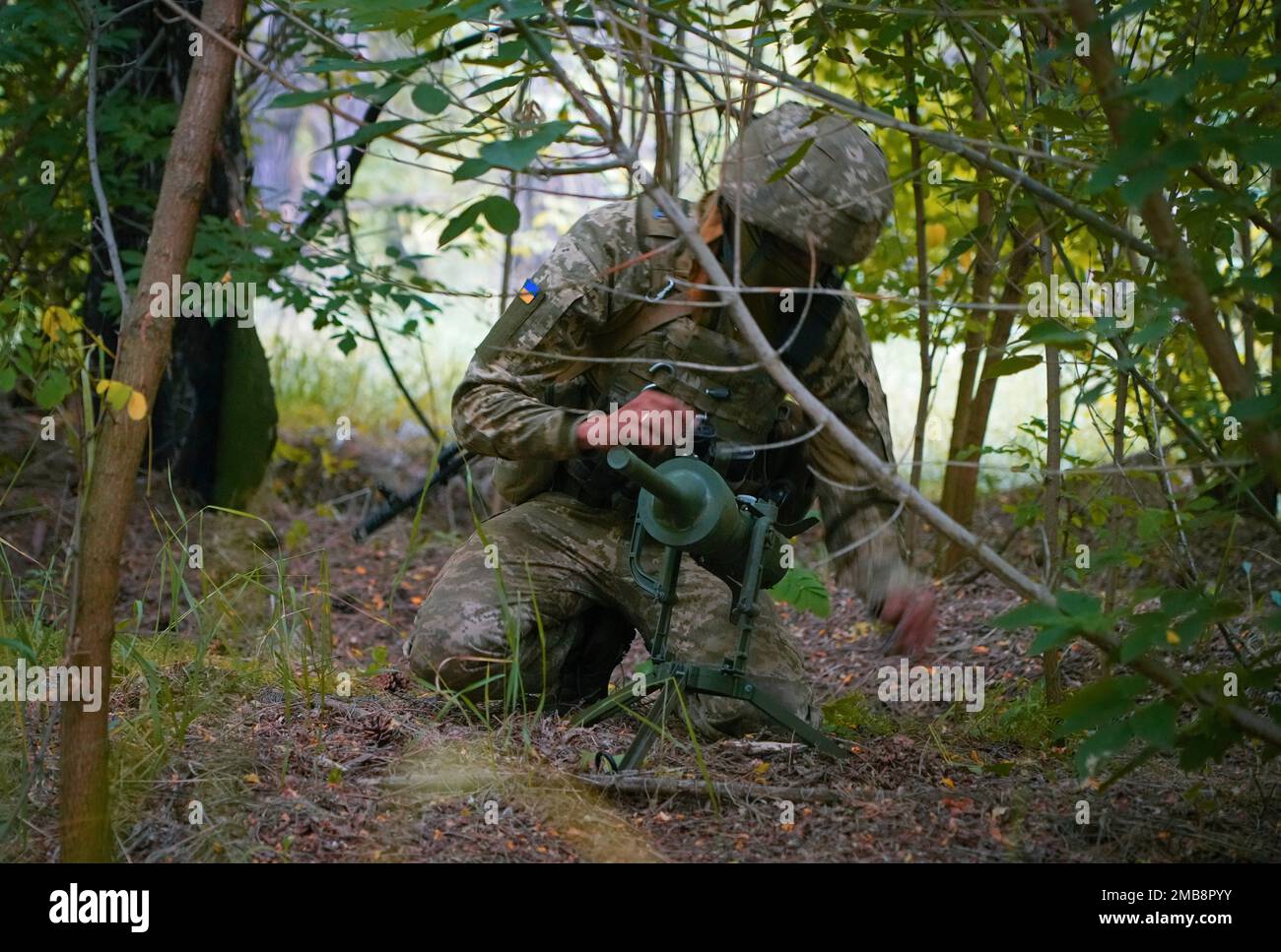 A soldier of Ukraine's special operations unit lays a Germany-donated ...