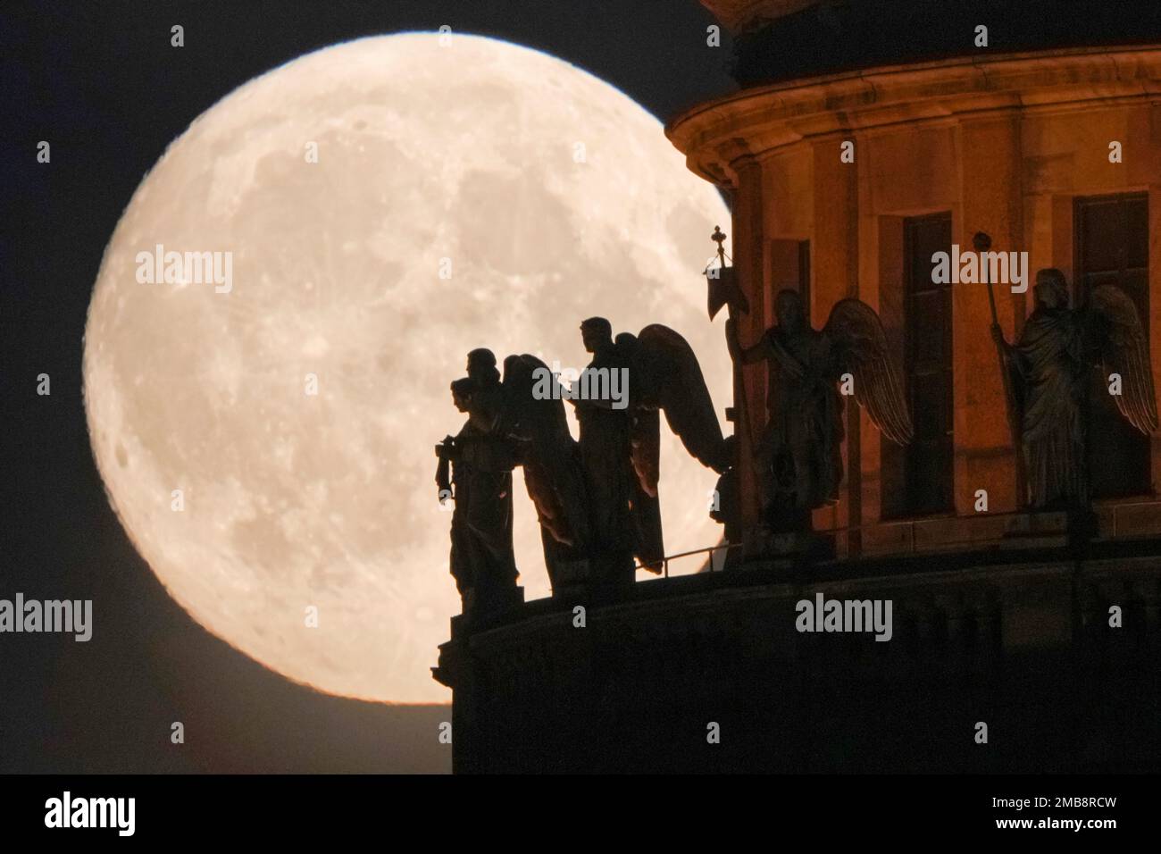 Sculptures of angels fixed at the St. Isaak's Cathedral are silhouetted ...