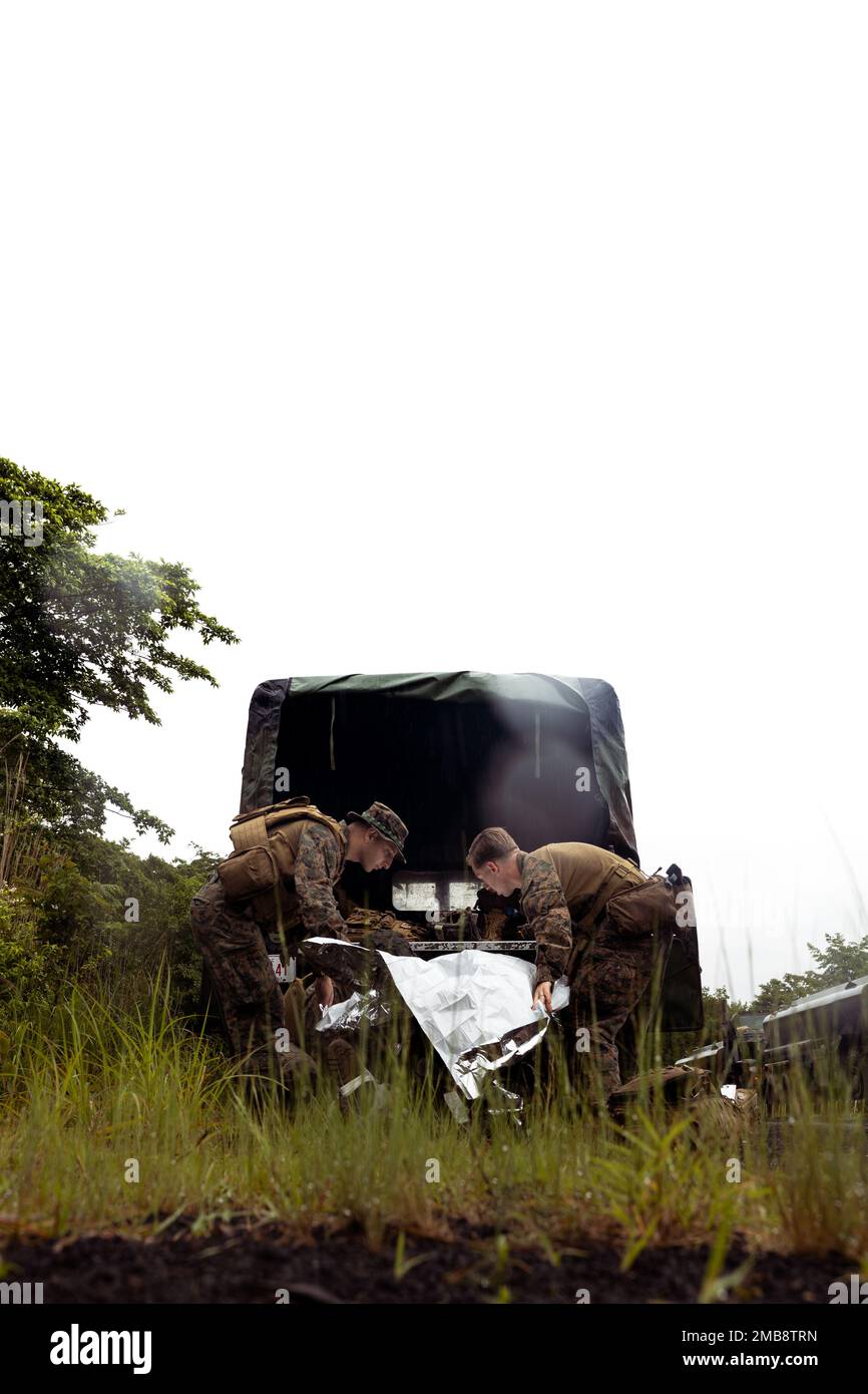 U.S. Navy Lt. Steven Azzam, a medical officer, and Hospital Corpsman ...