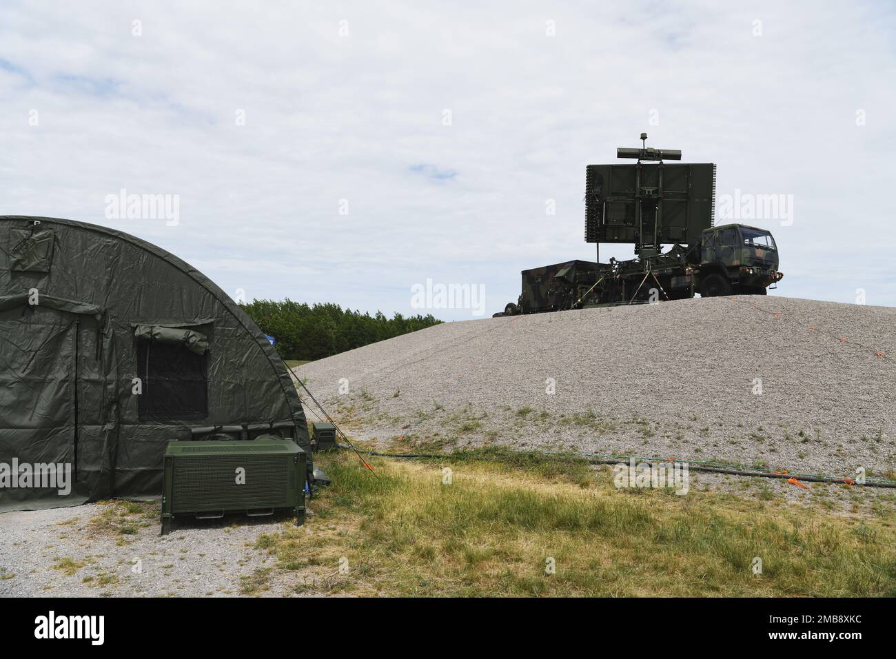 A U.S. Air Force AN/TPS-75, deployable field radar system, scans the ...