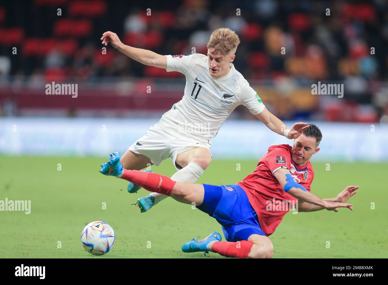 Costa Rica's Bryan Oviedo tackles New Zealand's Alex Grieve during the ...