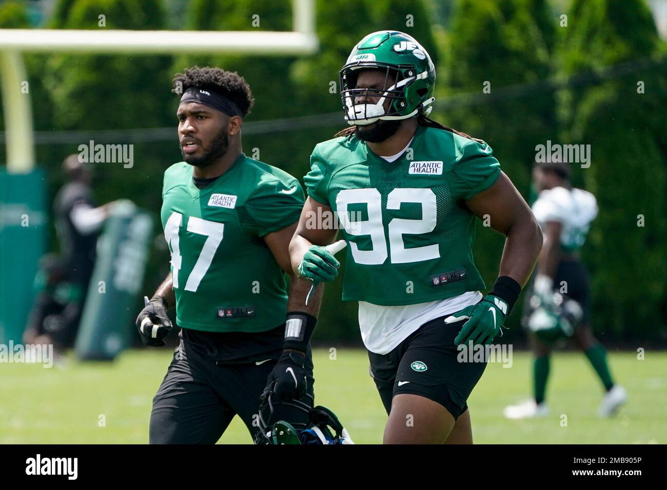 New York Jets defensive linemen Jabari Zuniga (92) and Bryce Huff (47 ...