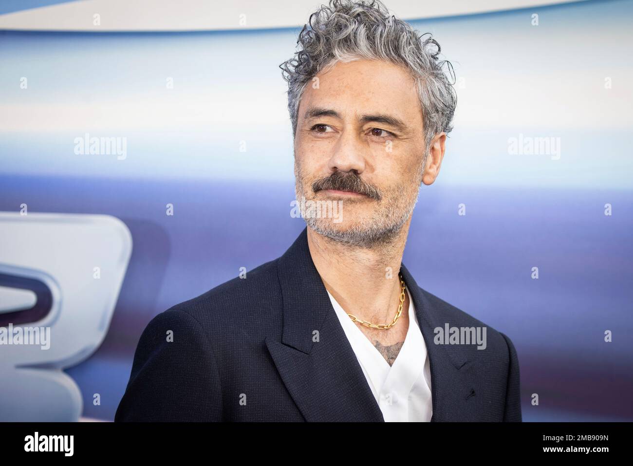 Taika Waititi poses for photographers upon arrival for the premiere of ...