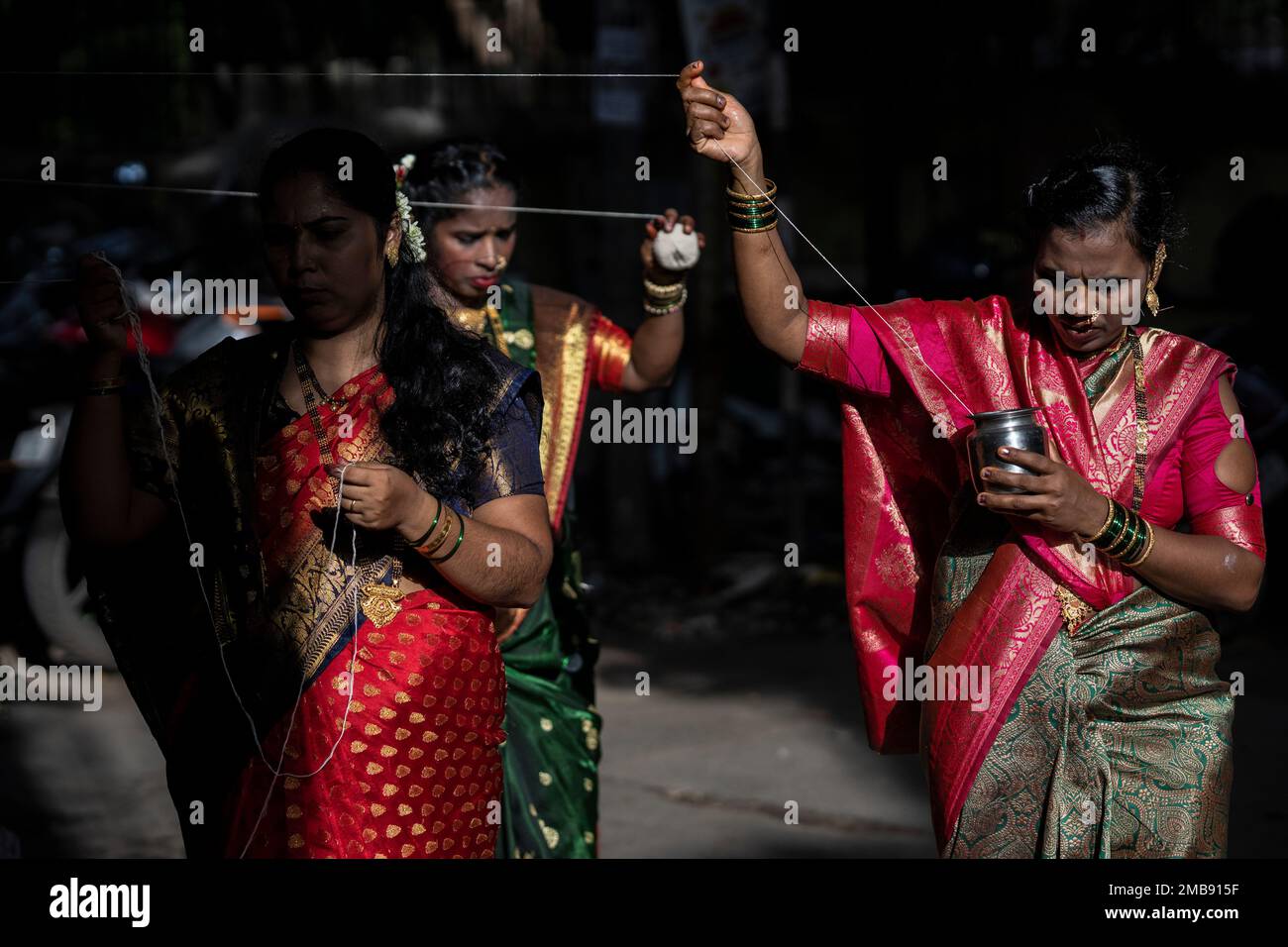 Hindu women perform rituals around a banyan tree on Vat Savitri ...