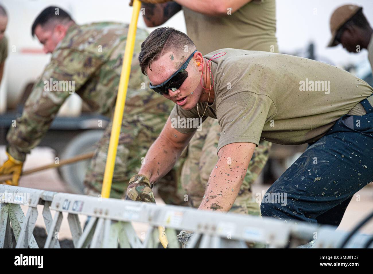 U.S. Air Force Senior Airman Michael Rogge, a pavements and heavy ...