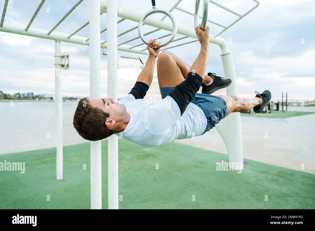 Sportive and athletic man doing functional training exercise at the ...