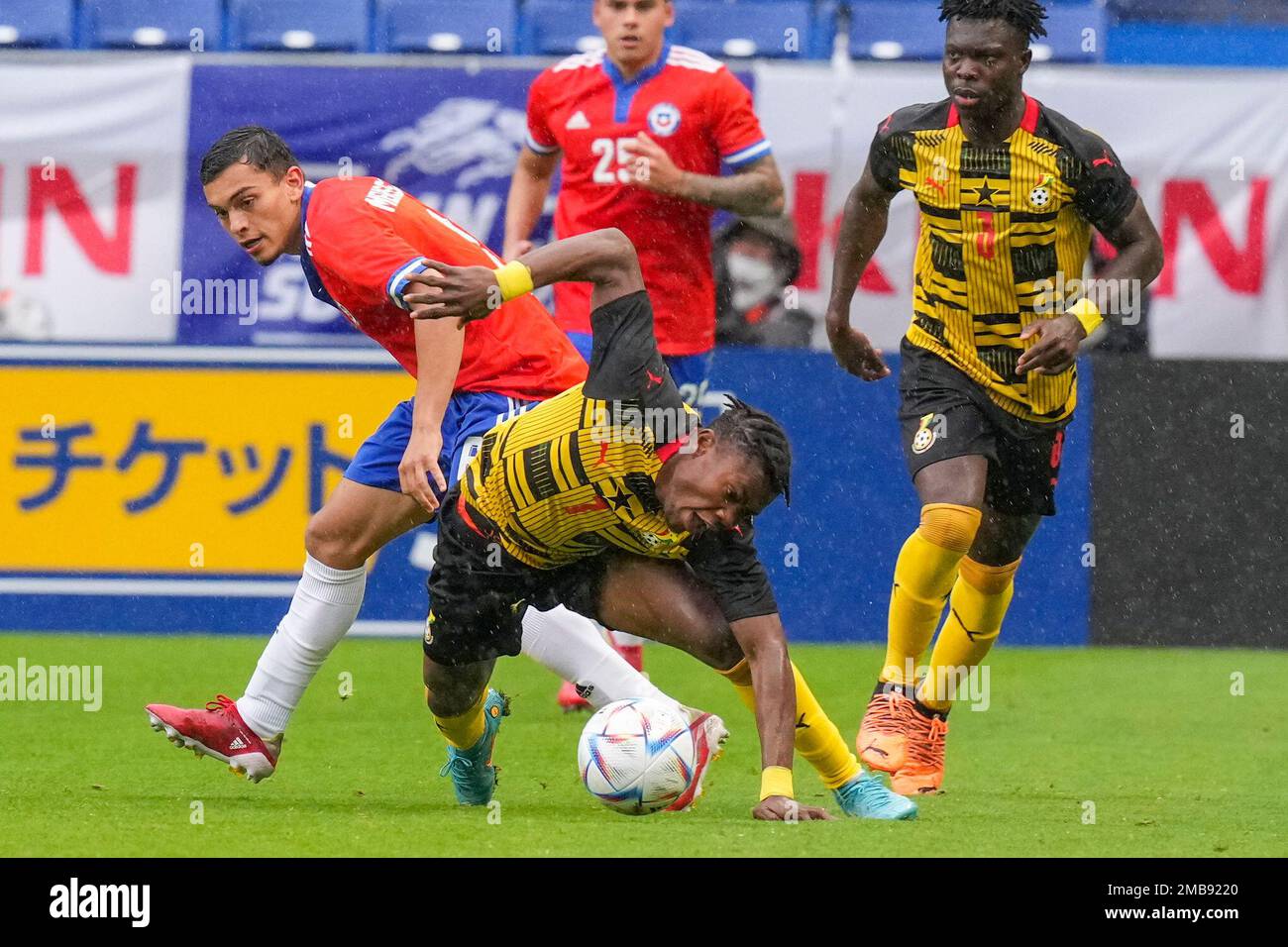 Ghana's Abdul Fatawu Issahaku and Chile's Nayel Mehssatou, left, battle ...