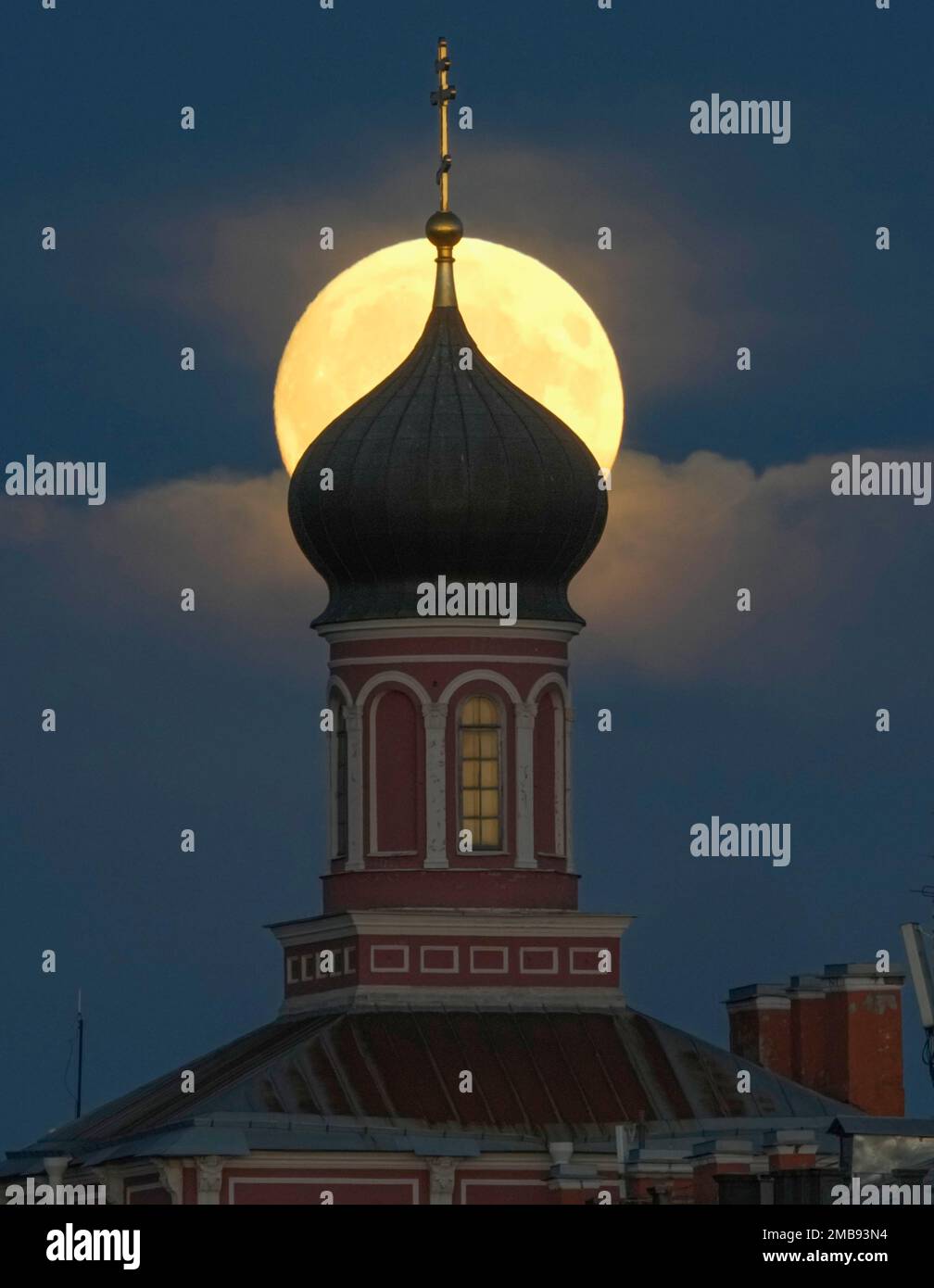 The full moon rises over a church in St. Petersburg, Russia, Monday ...